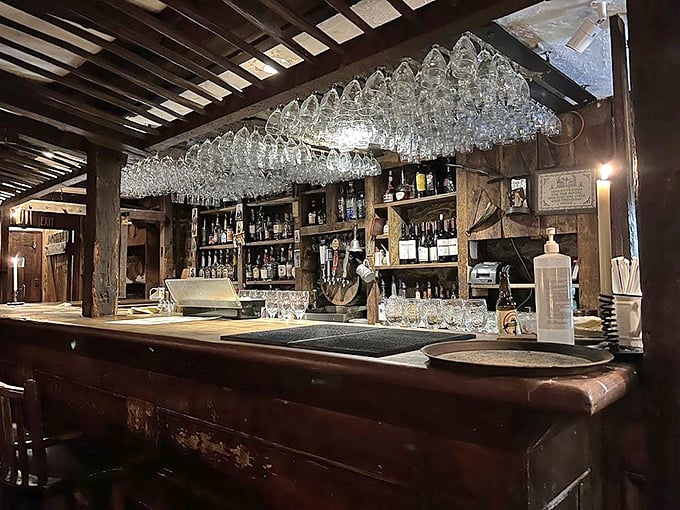 The tavern bar doesn't just serve drinks—it serves history, with wooden beams overhead and glassware that catches candlelight like liquid stars.