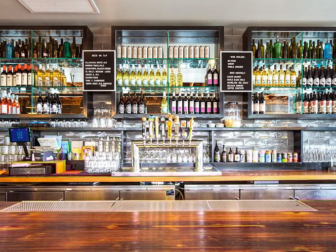 A bar stocked for serious business – because nothing complements slow-smoked meats quite like a thoughtfully selected bourbon or craft beer.