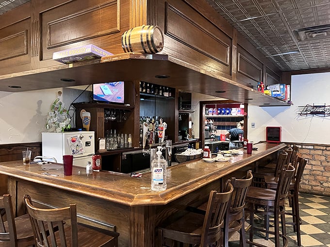 The bar area isn't trying to be trendy—it's aiming for timeless. That wooden barrel accent isn't just decoration; it's truth in advertising.