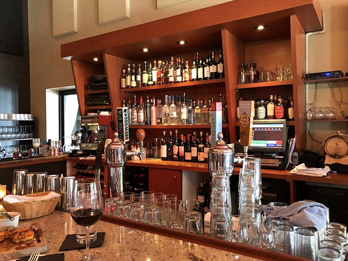 The well-stocked bar promises expert mixology and an impressive wine selection. That granite countertop has heard many great stories.
