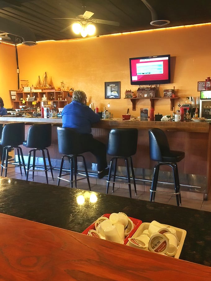 The bar area offers a front-row seat to the breakfast magic, where regulars perch like they're watching their favorite morning show.