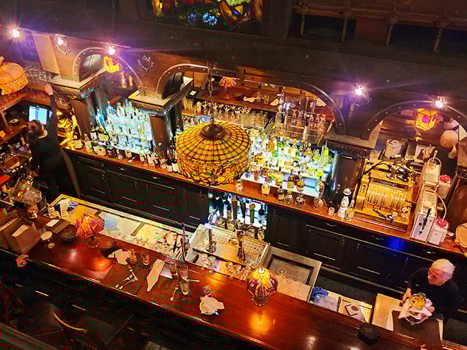 A bar that understands the art of proper illumination – where bottles glow like treasures and bartenders move like conductors orchestrating liquid happiness.
