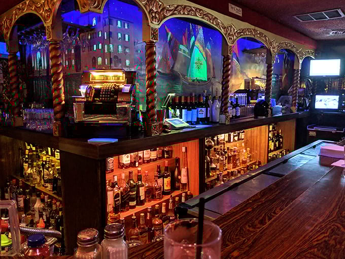 The bar is a masterpiece of old-school craftsmanship – where bottles glow like treasures and the bartenders know the difference between mixing and crafting.