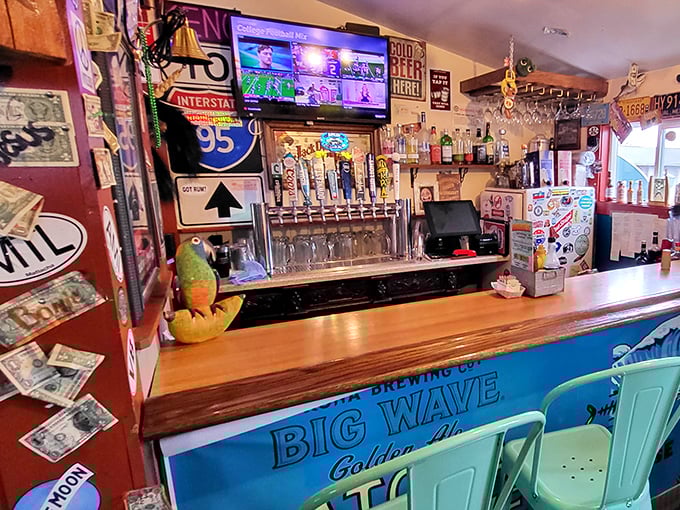 The bar area where cold beer flows and fishing stories grow. Notice how the Big Wave sign promises exactly what the food delivers.