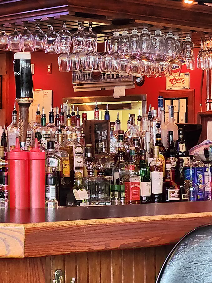 The bar isn't just stocked; it's armed for any beverage battle. Those hanging glasses await their moment to serve something cold and refreshing.