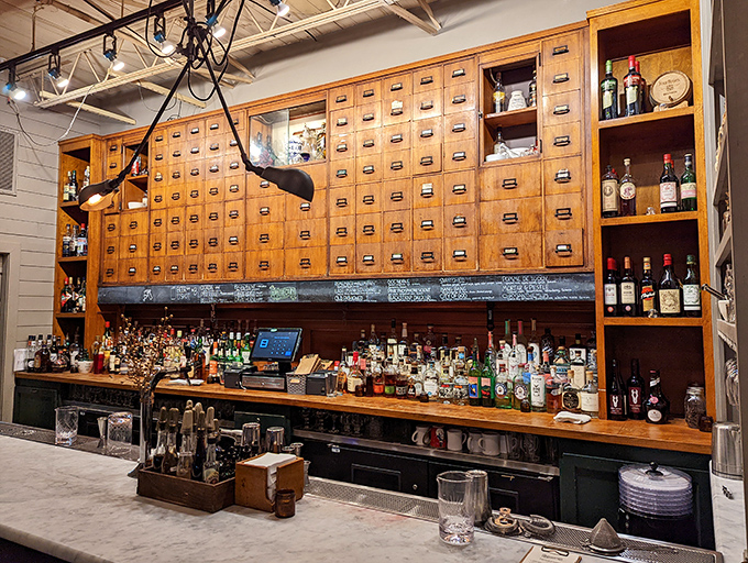 Behind this wooden apothecary facade lies The Apothecary, where the only prescription needed is a desire for craft cocktails with Southern charm.