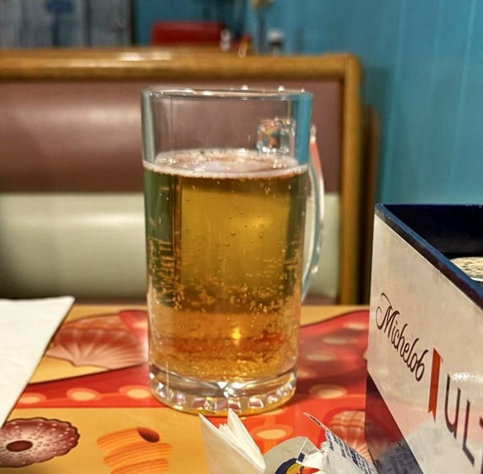 A cold beer in a frosty mug—because sometimes the perfect beverage pairing doesn't need to be complicated or come with a fancy name.