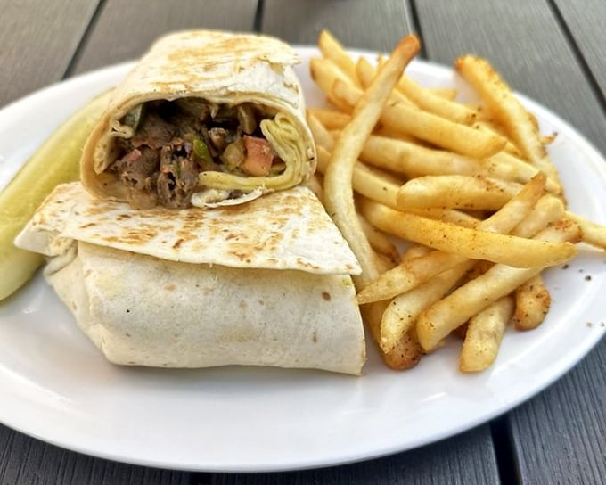 The breakfast burrito—for when you want all your morning favorites to attend the same party. Wrapped up tighter than my vacation plans, with fries playing backup.
