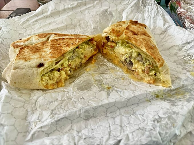 Breakfast burrito perfection – where eggs, cheese and morning dreams come wrapped in a warm tortilla hug.