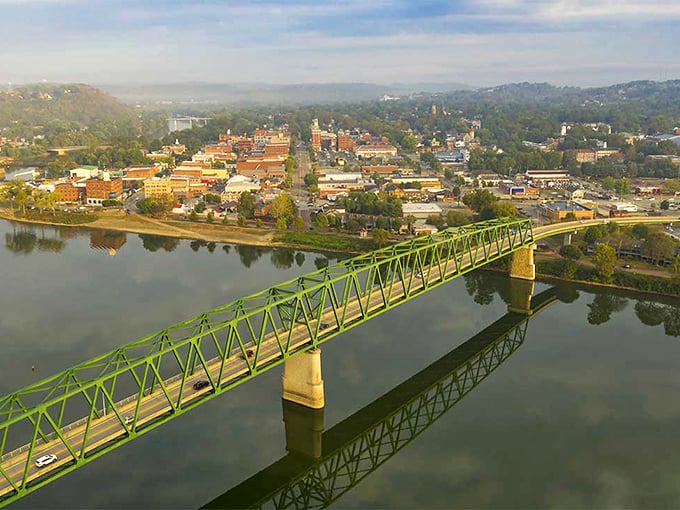 The green bridge spans more than just water—it connects Bellefontaine to neighboring communities, a steel ribbon tying the region together.
