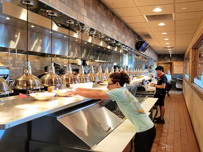 The open kitchen—where culinary magic happens without smoke, mirrors, or pretension—just honest cooking on display.