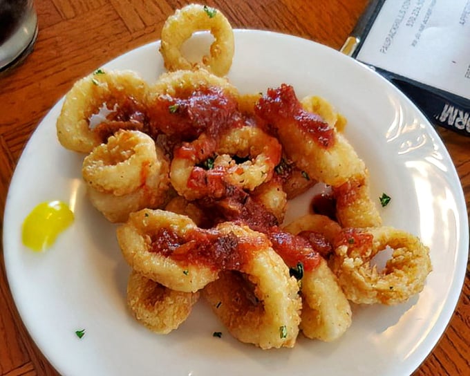 Calamari that defies the rubber-band reputation—these golden rings deserve Olympic medals for perfect texture and seasoning.