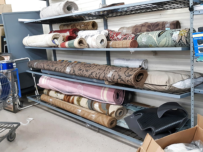 Rolled rugs stand at attention like soldiers. Each pattern tells a different story – from minimalist modern to intricate traditional designs. 