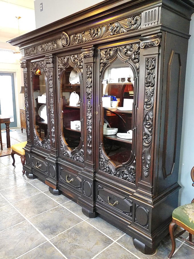 This intricately carved oak cabinet represents craftsmanship from an era when furniture wasn't assembled—it was sculpted, with patience and profound skill.