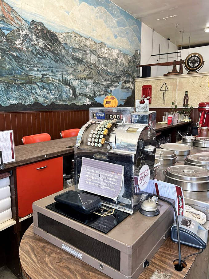 The vintage cash register isn't just for transactions—it's a museum piece that's witnessed countless "I'll have what they're having" moments.