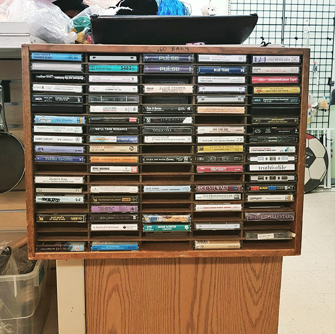 A time capsule of musical history sits on display – cassette tapes that transport Gen X shoppers back to the days of carefully crafted mixtapes.