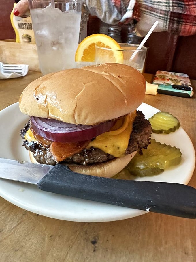 The classic American cheeseburger, perfected. That melted cheese cascading down the patty isn't just delicious—it's practically patriotic.