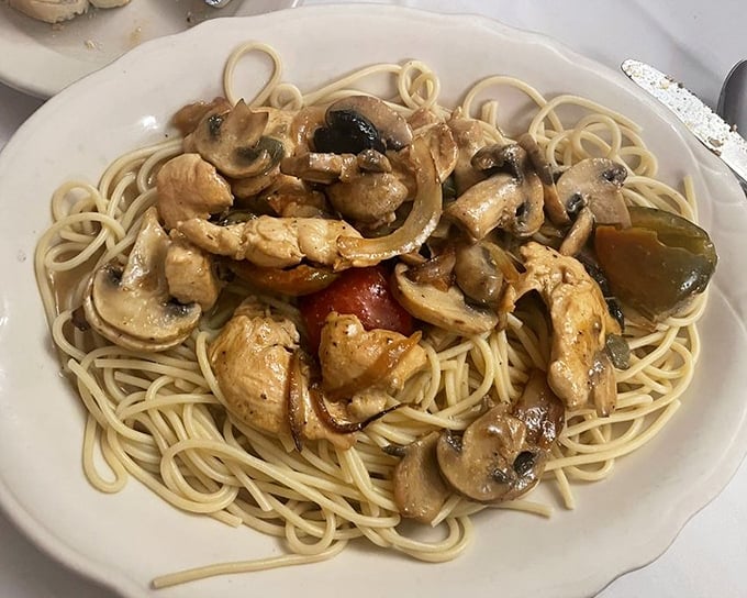 Chicken and mushrooms playing perfectly together on a bed of spaghetti—like an old married couple who still finish each other's sentences.