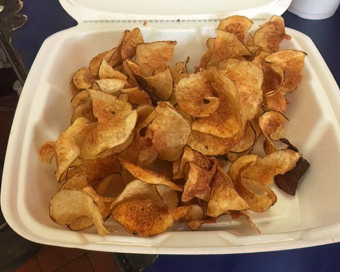 House-made chips that shatter with each bite – these aren't your average bagged snacks, they're potato slices that reached their highest calling.