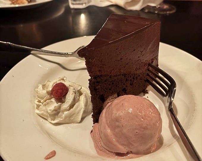 Chocolate cake so rich it should have its own tax bracket, served with ice cream that melts into a creamy moat of deliciousness.