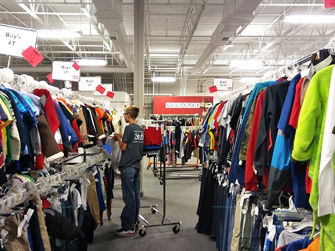 The men's department—where shirts hang like colorful soldiers in formation, ready to march into your wardrobe at a fraction of retail.