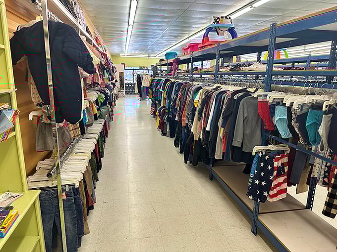 Endless racks of clothing create pathways through fashion history, from bell-bottoms to skinny jeans.