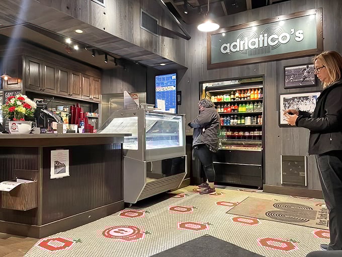 Where pizza dreams come true – the counter where anticipation builds as you watch your order being prepared with practiced precision.