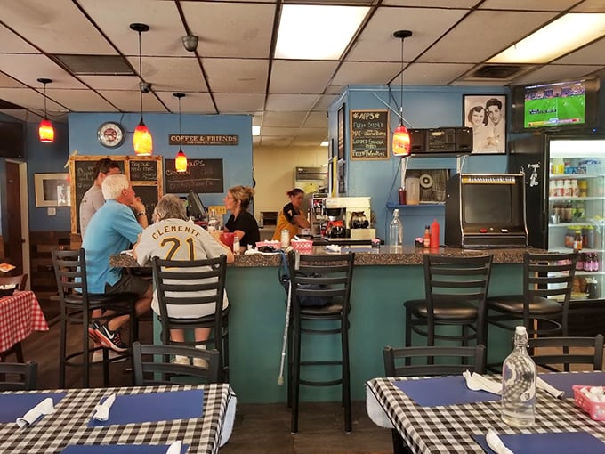 The counter—that sacred space where regulars perch, coffee flows freely, and the day's gossip is exchanged like currency.