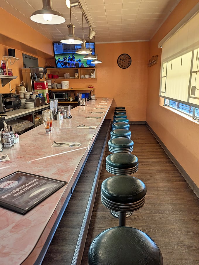 The counter seating: where solo diners become food critics and the coffee refills flow like the Rio Grande. Some of life's best conversations happen here.