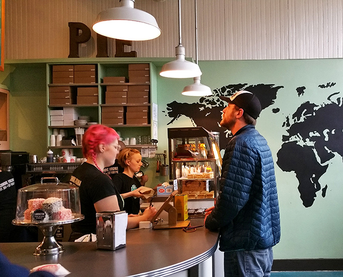 The world map wall art isn't just decoration—it's a promise that these pies will take your taste buds on an international journey without passport requirements.