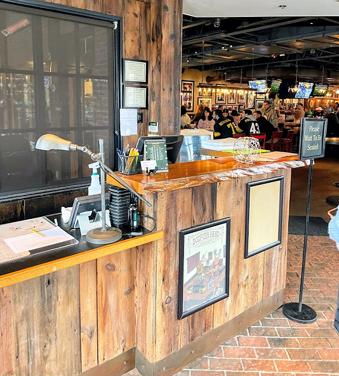 The host stand welcomes you with rustic charm—the wooden panels and brick floor setting the tone for the unpretentious excellence that awaits inside.