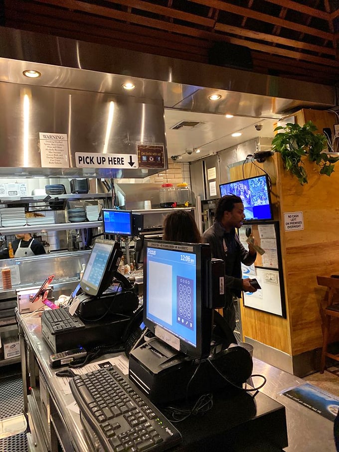 The bustling counter area offers a glimpse into the kitchen's organized chaos, where Brazilian culinary magic happens daily.