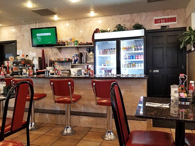 The beating heart of any great diner – a counter where strangers become friends over coffee refills.