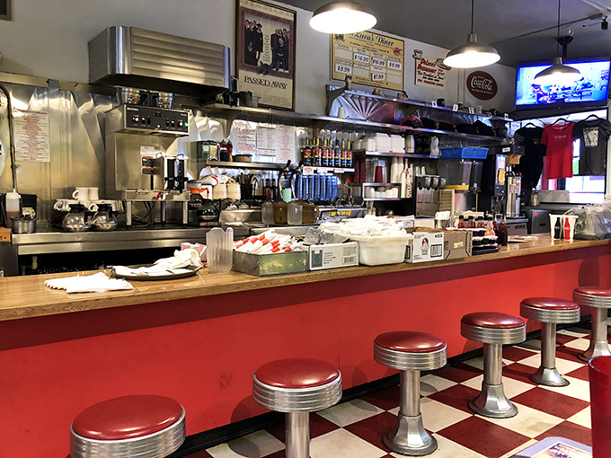 Those red counter stools have witnessed first dates, business deals, and countless "I shouldn't, but I will" moments of ordering extra bacon.