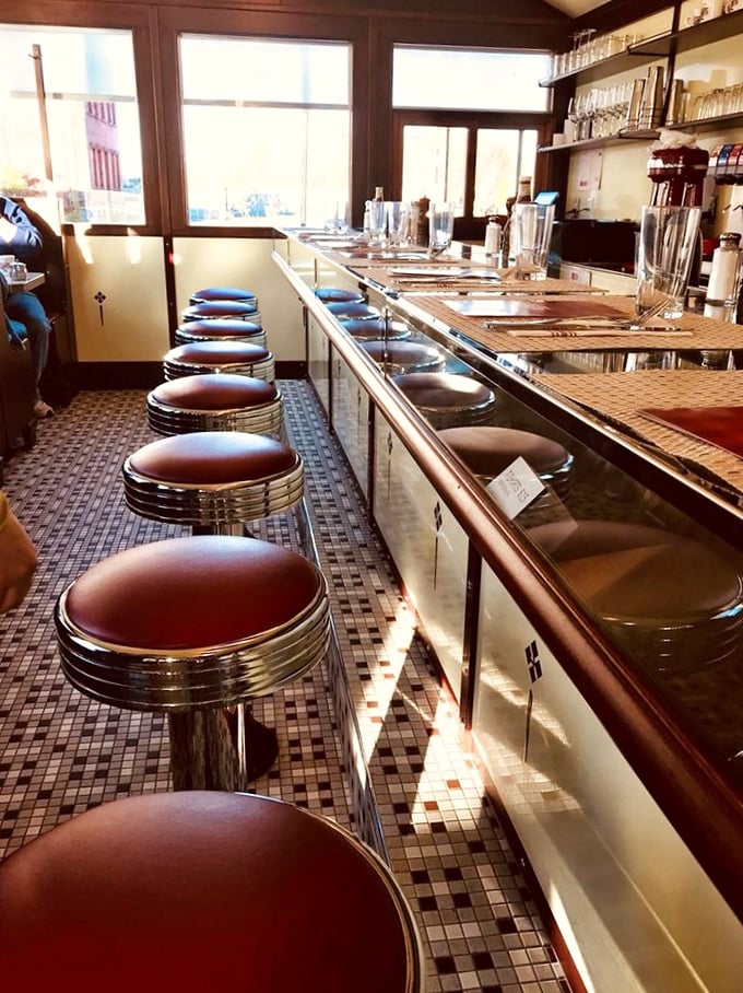 Another angle of those gleaming counter stools, each one a throne for hungry breakfast royalty.