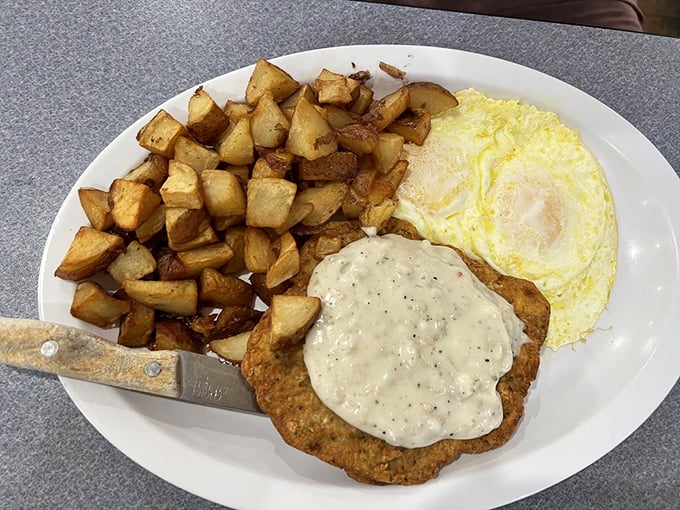 Country fried steak with gravy that could make a vegetarian temporarily reconsider their life choices. The eggs and potatoes are just supporting actors.