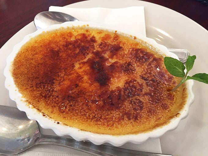 Crème brûlée with a sugar crust so perfectly torched it makes a satisfying "crack" that's music to dessert lovers' ears. That mint leaf is the green light saying "Go!"