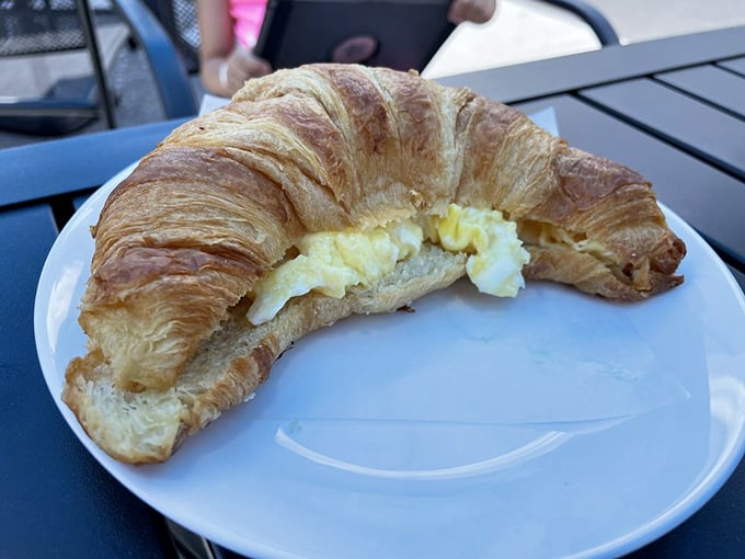 This croissant didn't just accept its egg filling—it embraced it, creating a breakfast union that would make any French baker nod in approval.