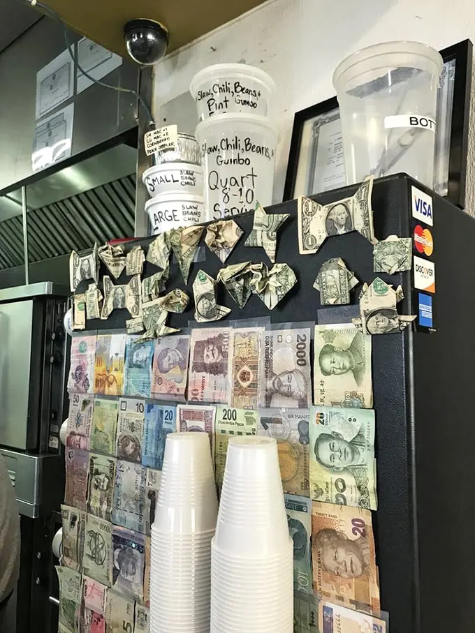 Money from around the world decorates this wall—proof that great barbecue transcends currency, language, and international borders.