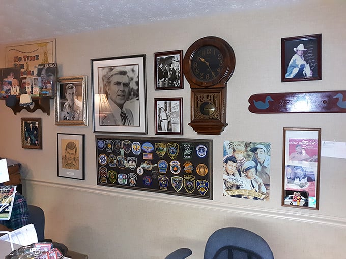 The wall of fame showcases Mayberry connections – Andy Griffith's hometown pride displayed alongside badges from visiting police departments nationwide.