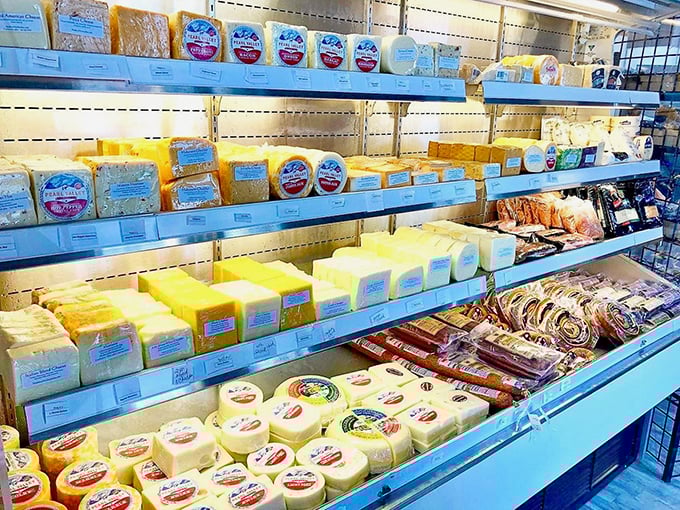 A cheese display so beautiful it deserves its own ZIP code – from mild to wild, each variety waiting to elevate your sandwich from great to legendary.