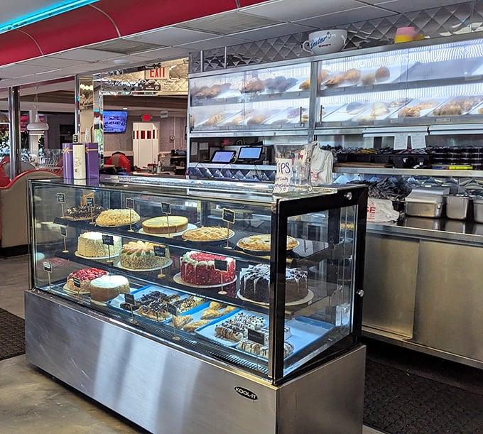 The dessert case—that glass-enclosed temple of temptation—where willpower goes to die and "I'll just have coffee" turns into "and a slice of that cake."