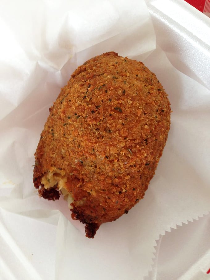 The Devil Crab looks innocent enough in its crispy shell, but one bite reveals a spicy secret that's been keeping Tampa locals coming back for more.
