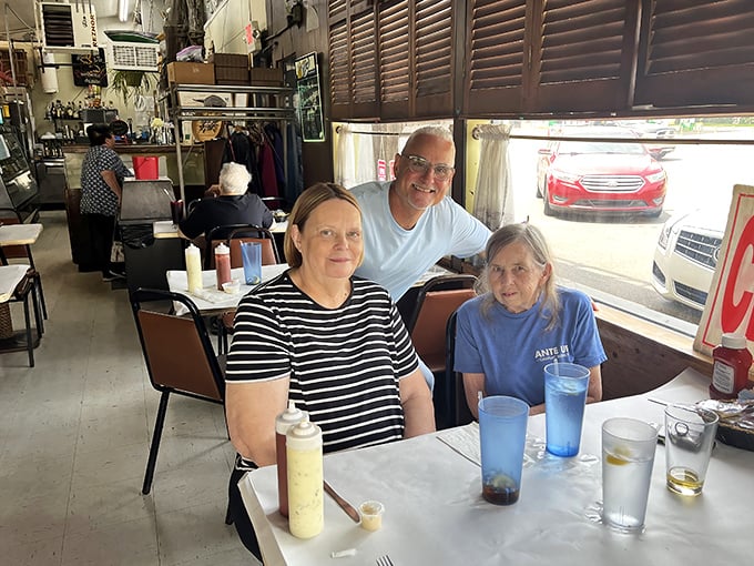 Three generations sharing seafood smiles – proof that great food creates the best family memories.