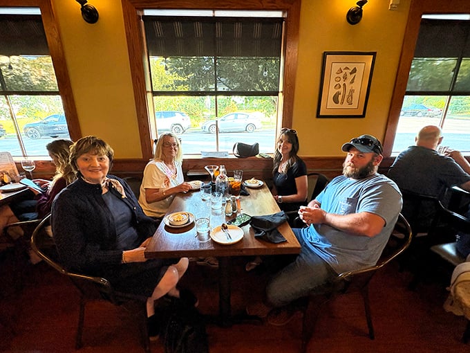Happy diners caught in their natural habitat—the moment right before the "should we get dessert?" conversation that always ends with "absolutely we should." 