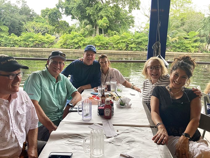 Waterfront dining with good company—the true Florida trifecta. Those smiles say everything about the Rustic Inn experience.
