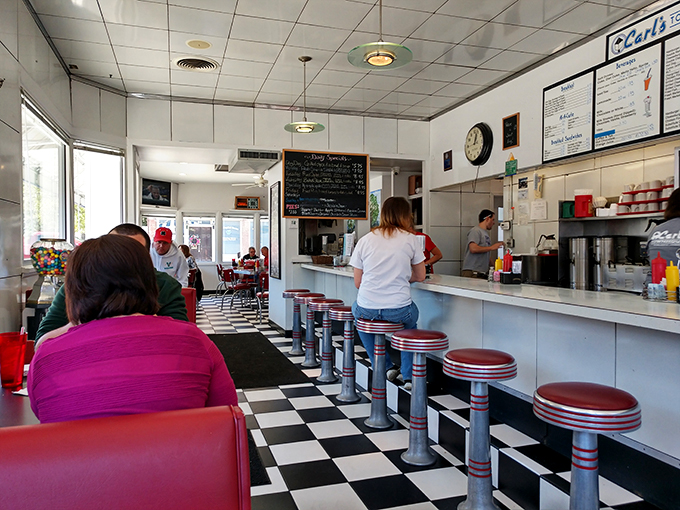 The counter at Carl's isn't just seating—it's front-row tickets to the best show in town: breakfast made with decades of practice.