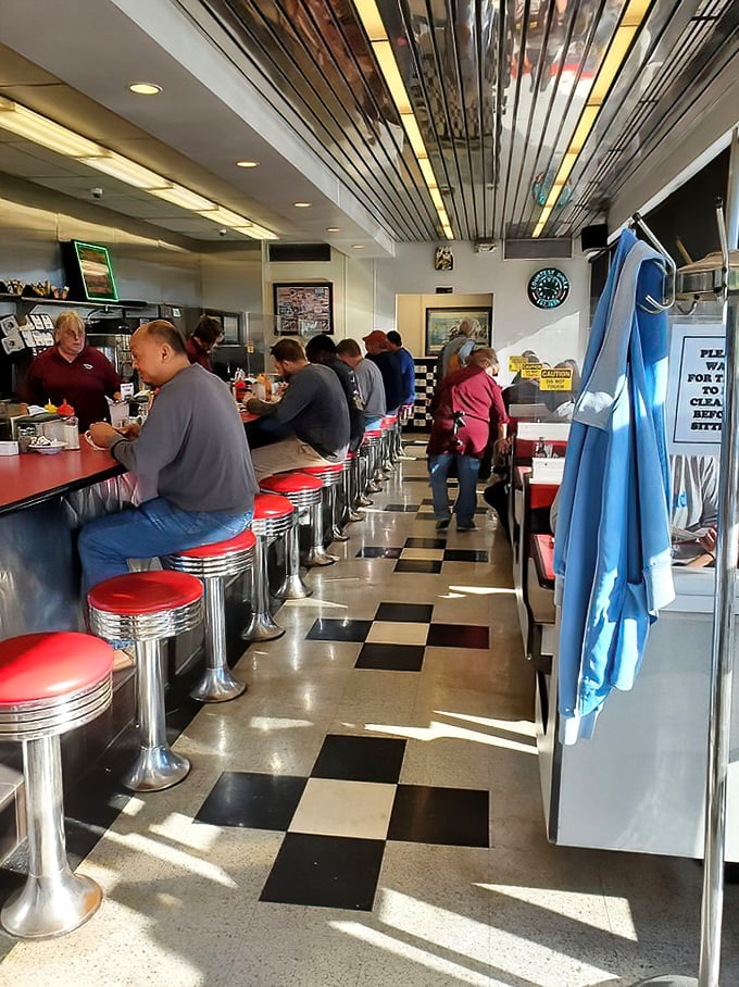 Morning in America looks like this—strangers sharing counter space, united by the universal language of "pass the ketchup, please."