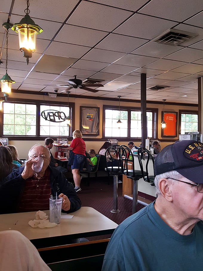 The dining room hums with conversation and satisfaction. These aren't customers—they're regulars who've earned their booth privileges.