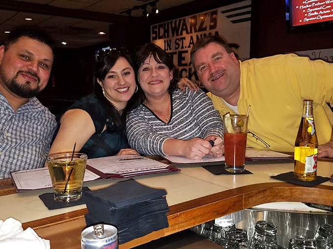 Happy faces at the bar tell the real story – Schwarz's isn't just about food, it's about creating moments worth remembering.